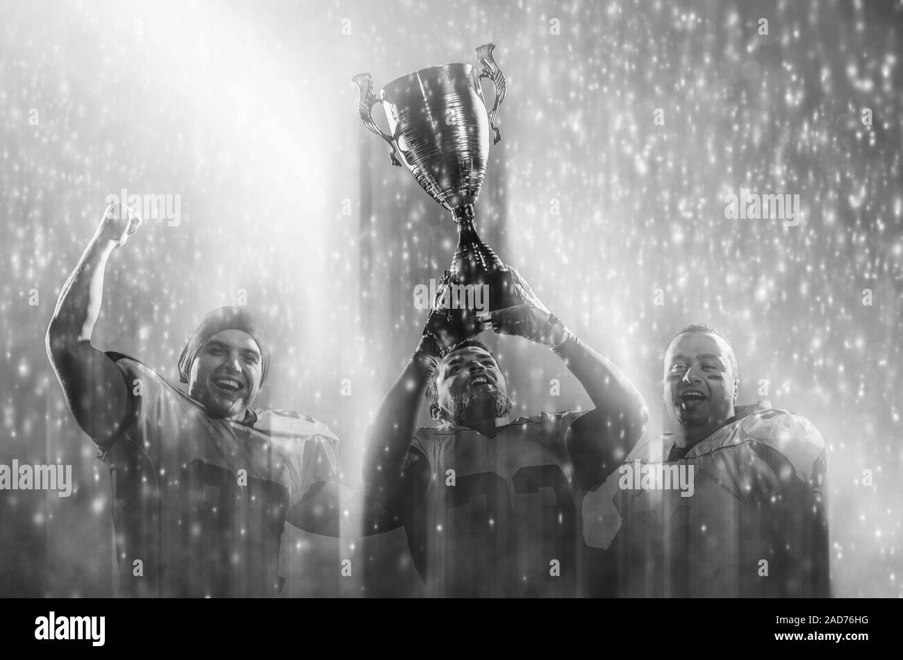 american football team with trophy celebrating victory in the cup final ...
