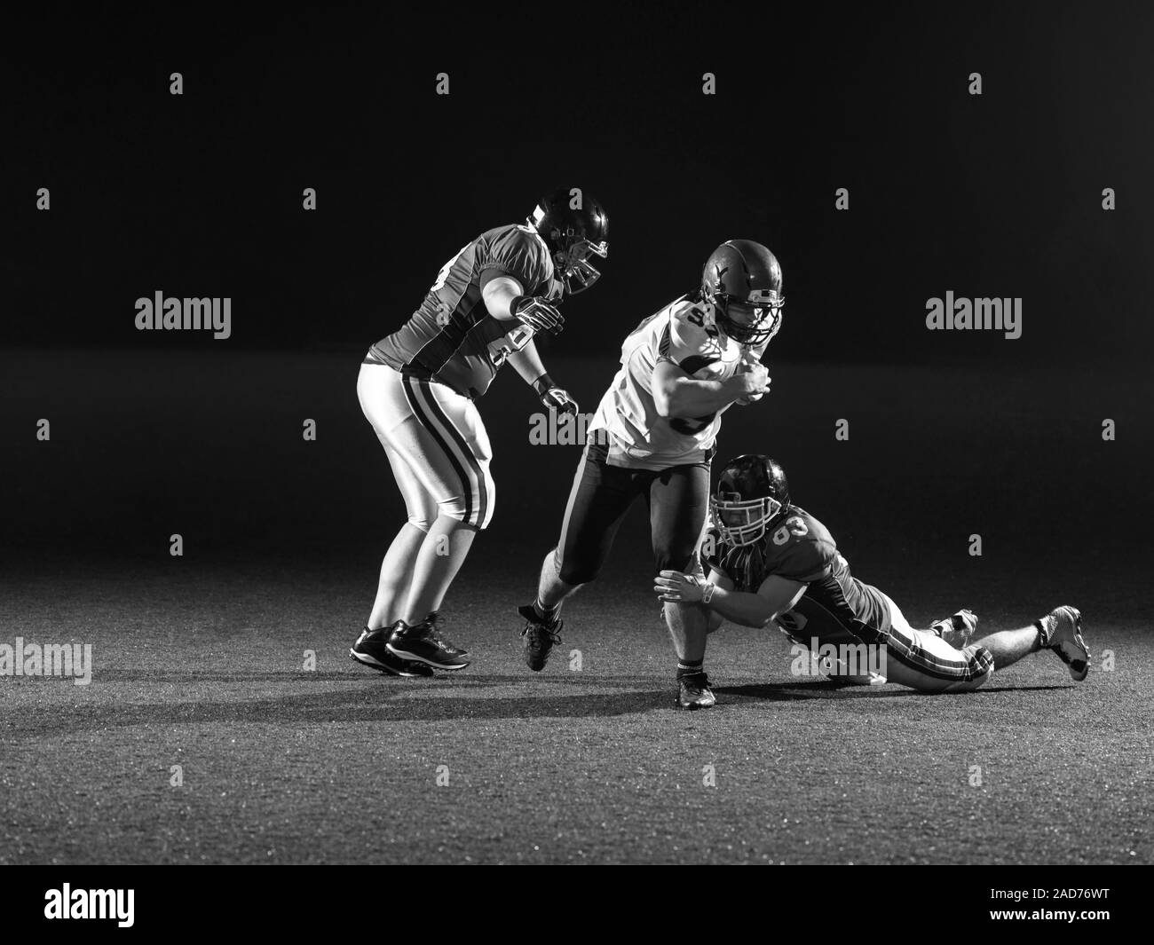 American football players in action Stock Photo - Alamy