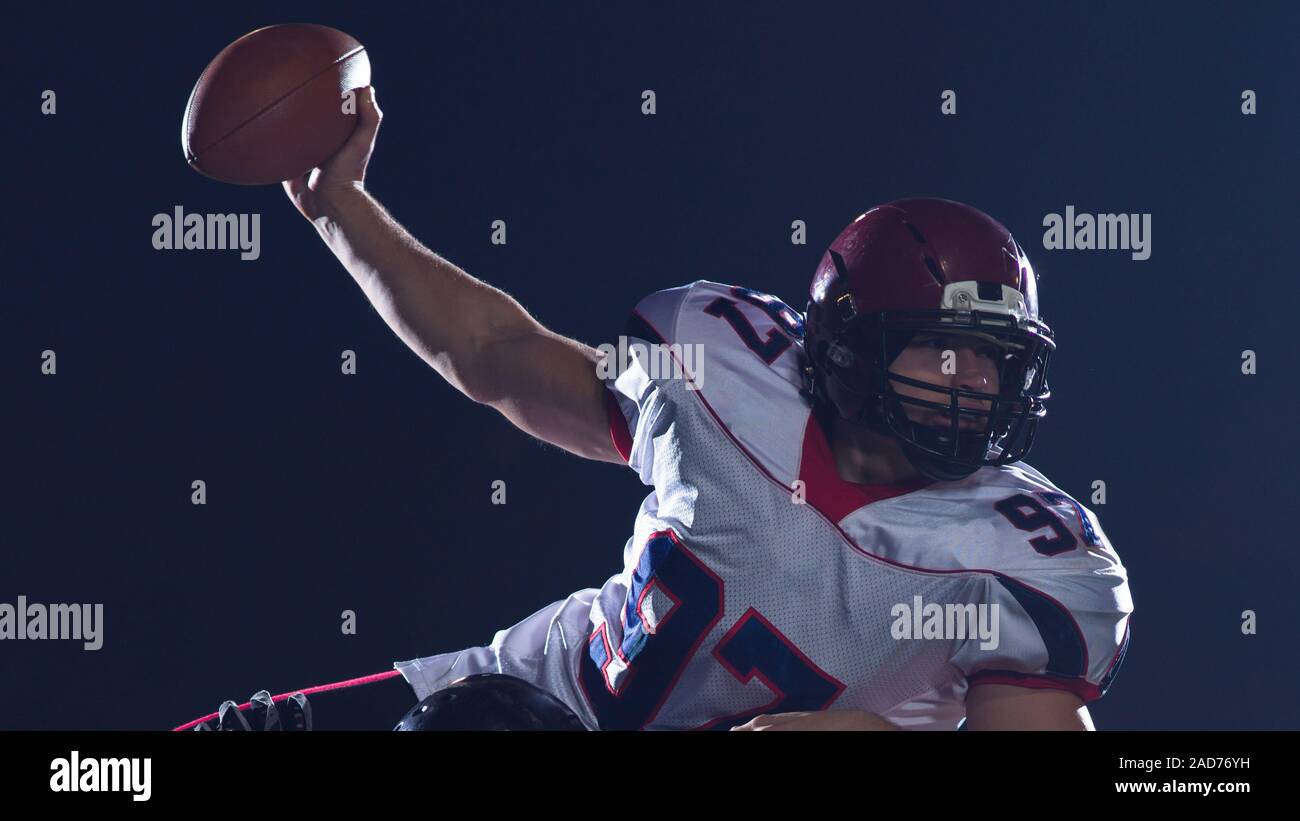American football players in action Stock Photo - Alamy