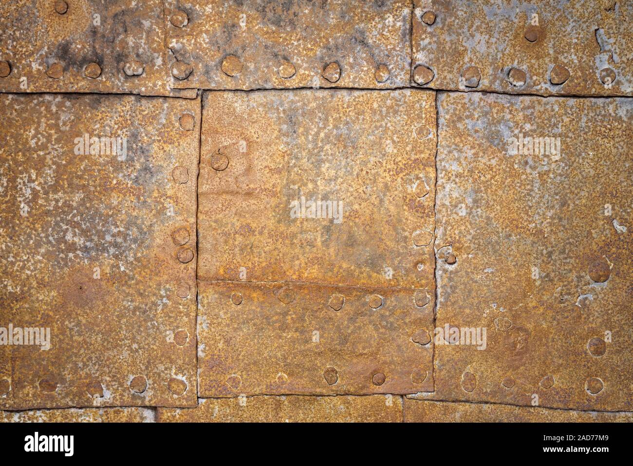 Rusty metal plates with rivets as background Stock Photo - Alamy