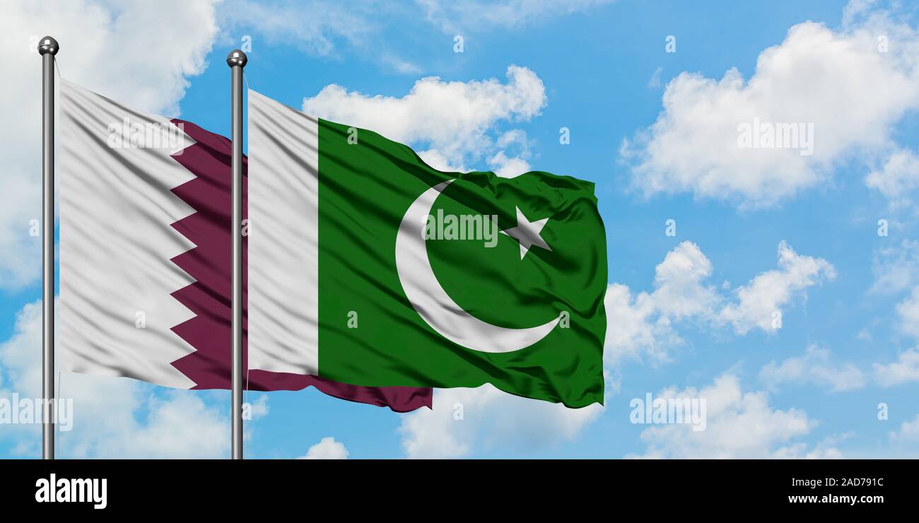 Qatar and Pakistan flag waving in the wind against white cloudy blue ...