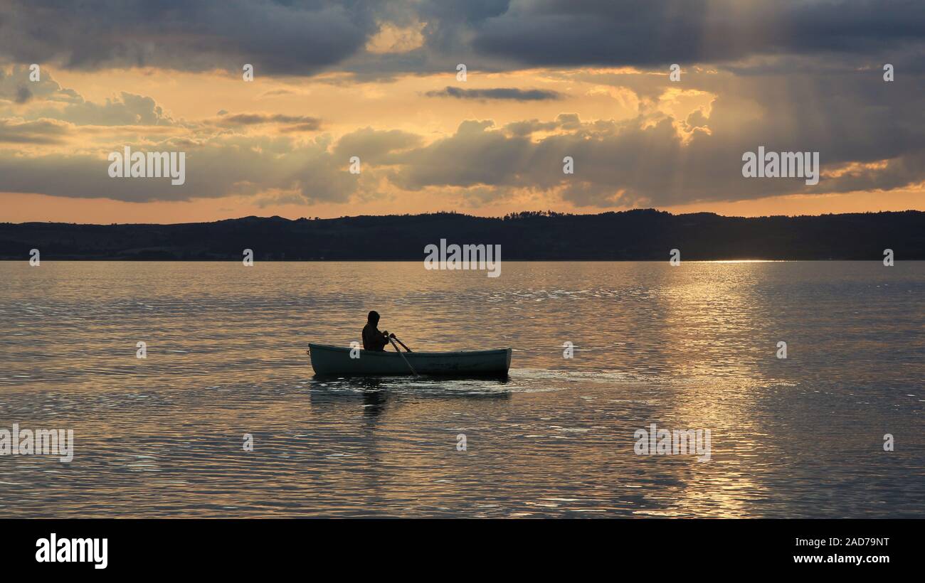 Man rowing a small boat hi-res stock photography and images - Alamy