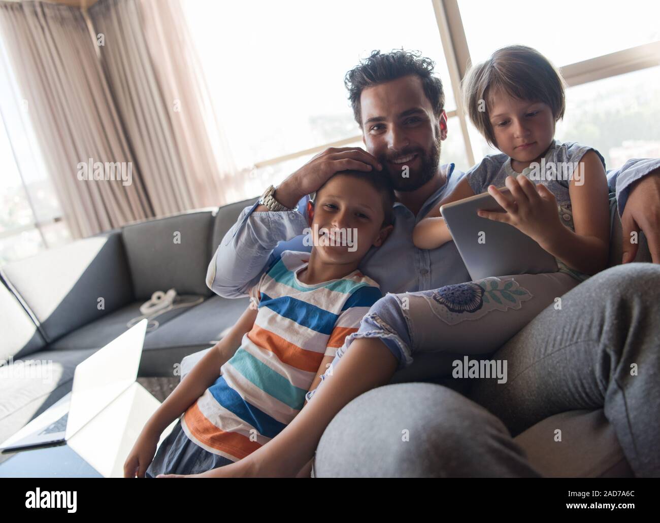 happy young father spending time with kids Stock Photo - Alamy