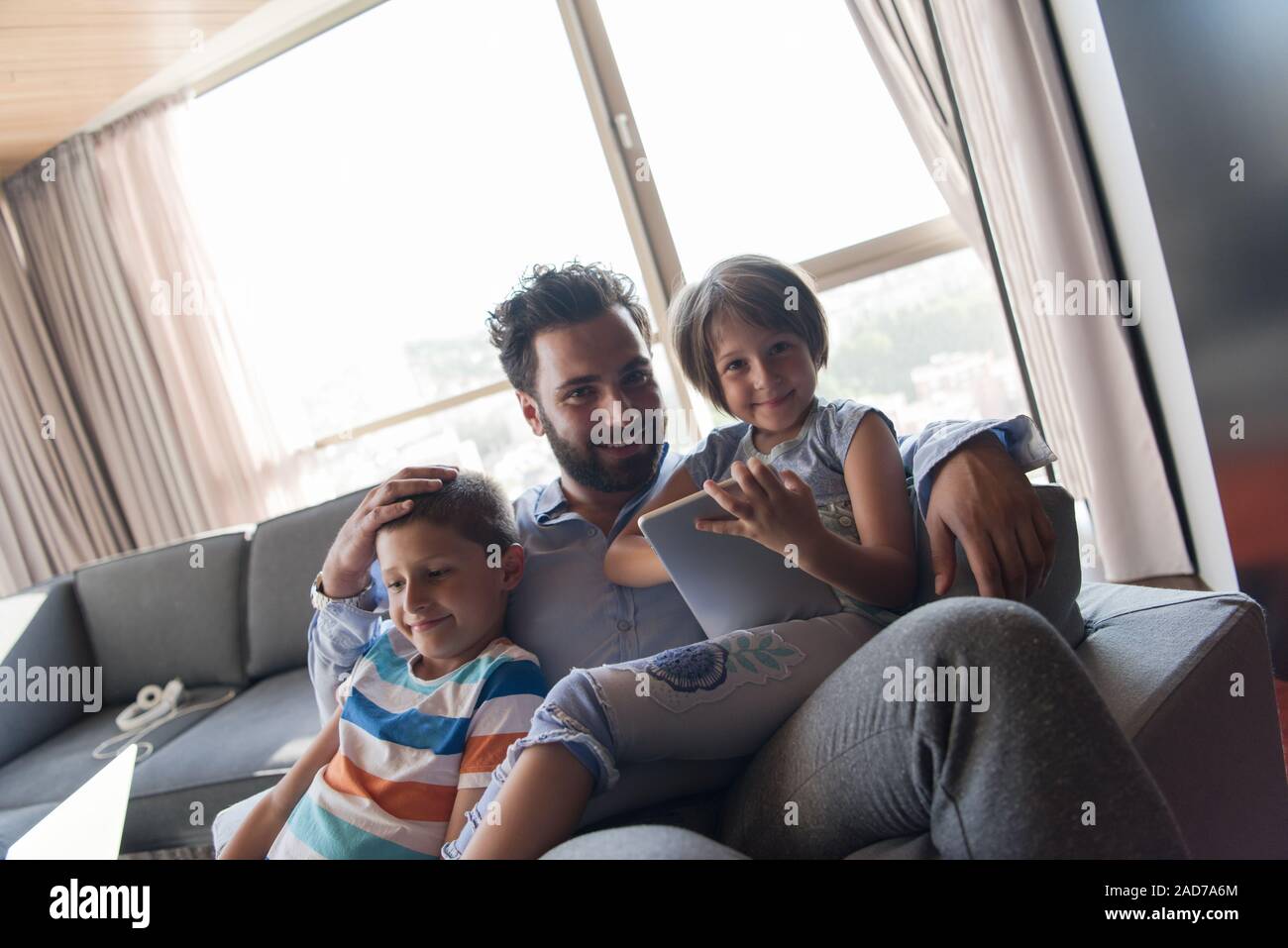 happy young father spending time with kids Stock Photo - Alamy