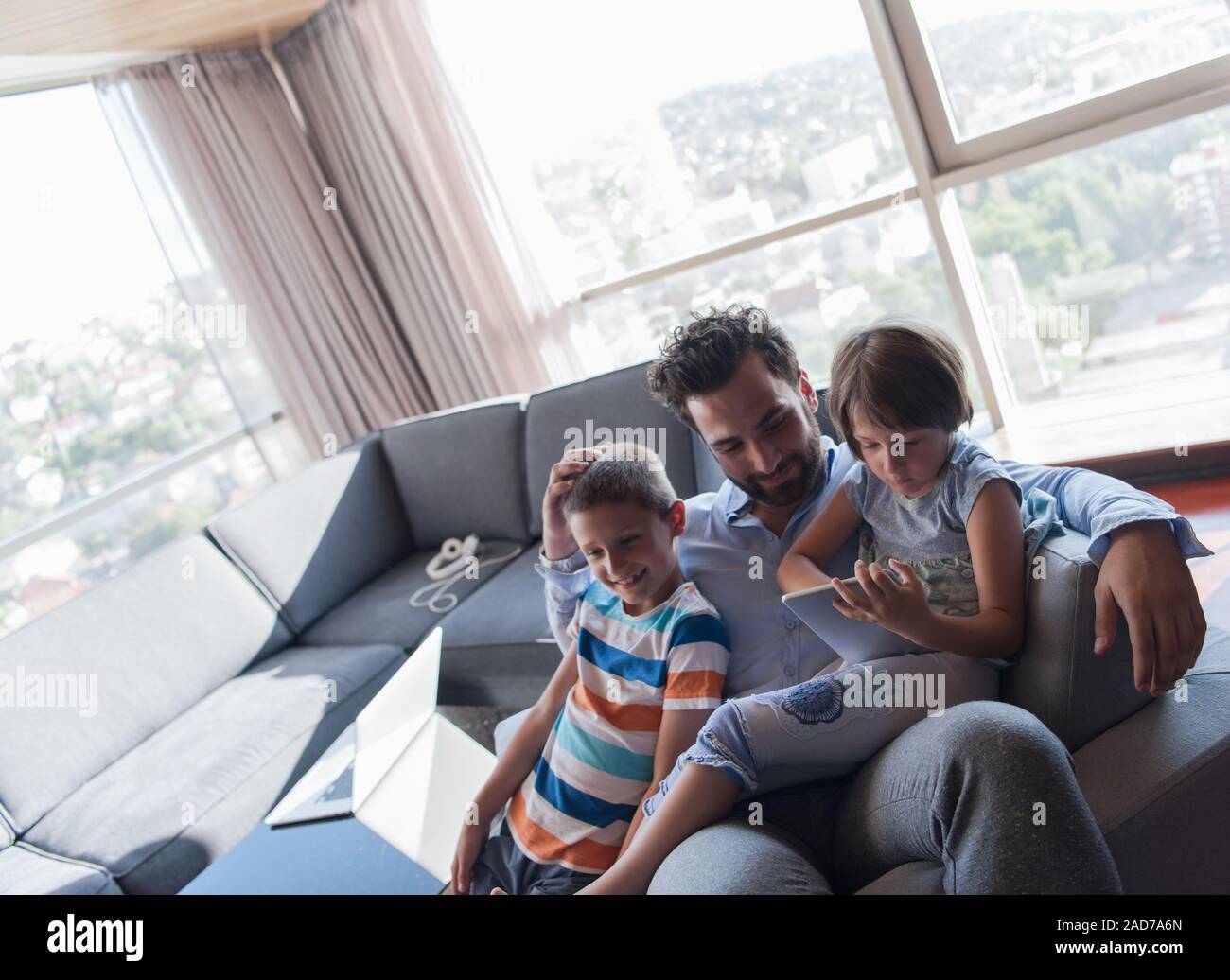 happy young father spending time with kids Stock Photo - Alamy