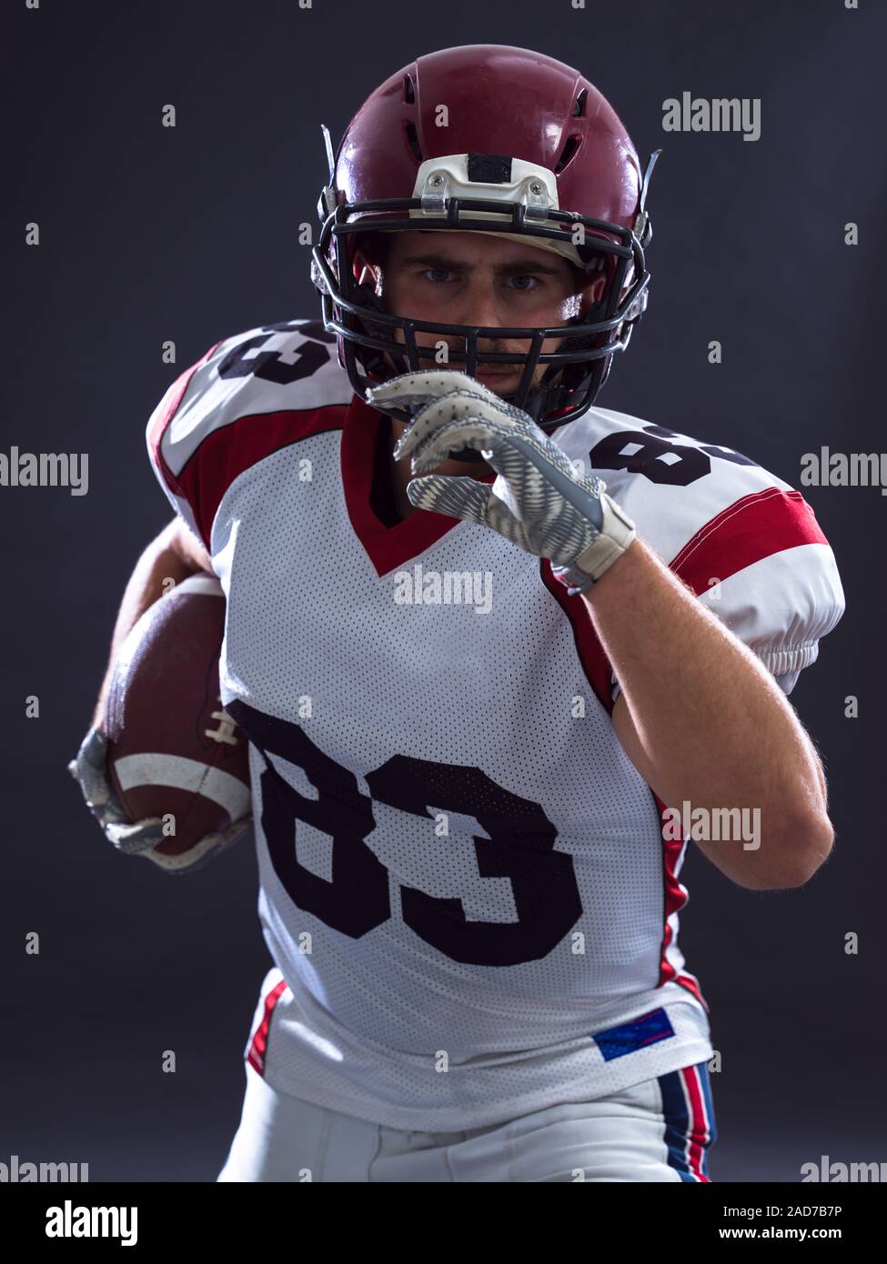 American football Player running with the ball Stock Photo - Alamy