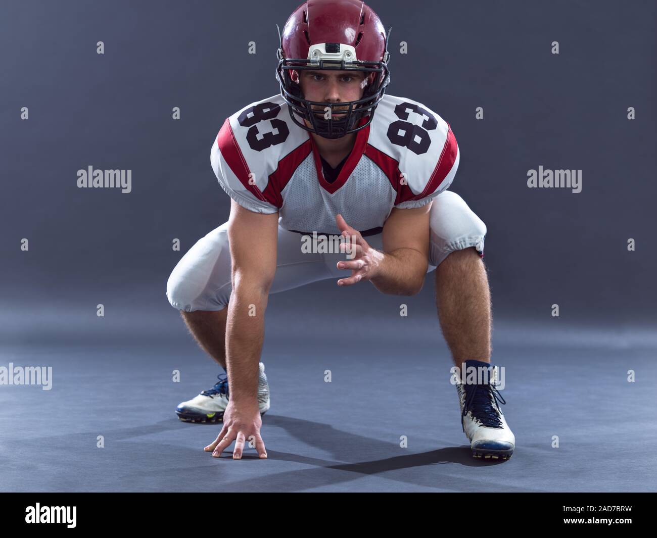 American football player getting ready before starting Stock Photo - Alamy