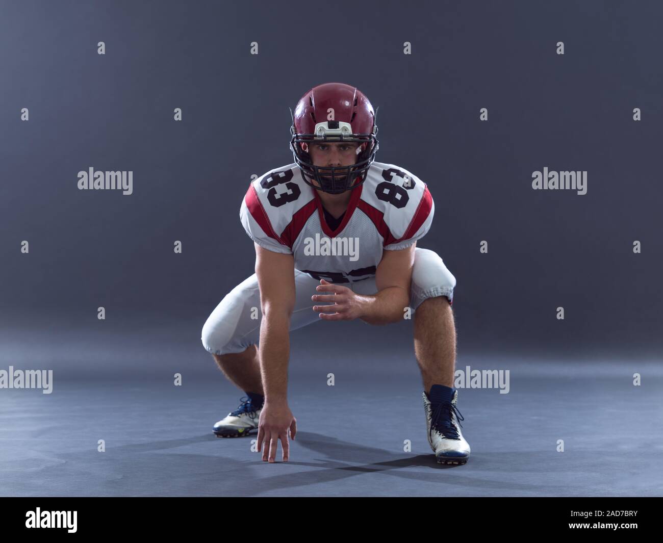 American football player getting ready before starting Stock Photo - Alamy