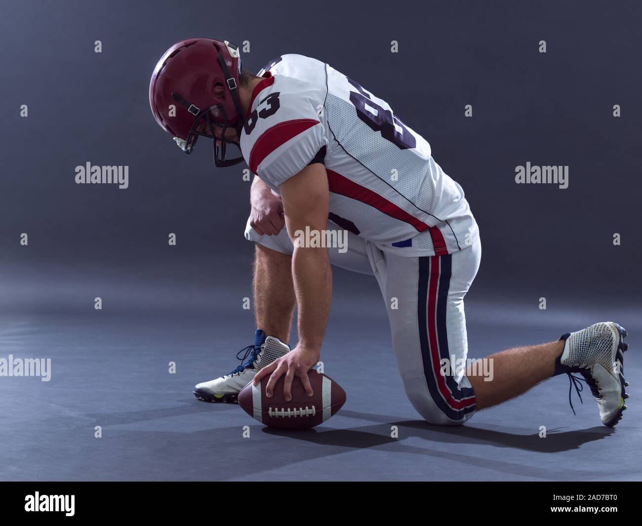 American football player getting ready before starting Stock Photo - Alamy
