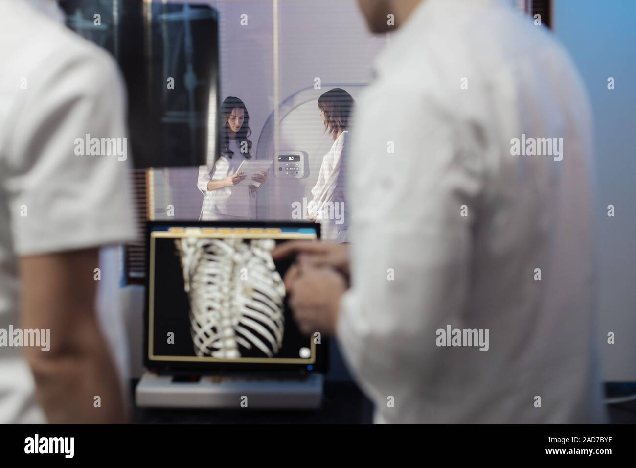 In Control Room Doctor and Radiologist Discuss Diagnosis while Watching ...