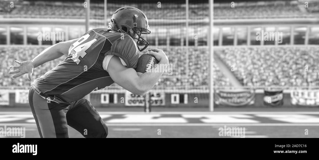 American football Player running with the ball Stock Photo - Alamy