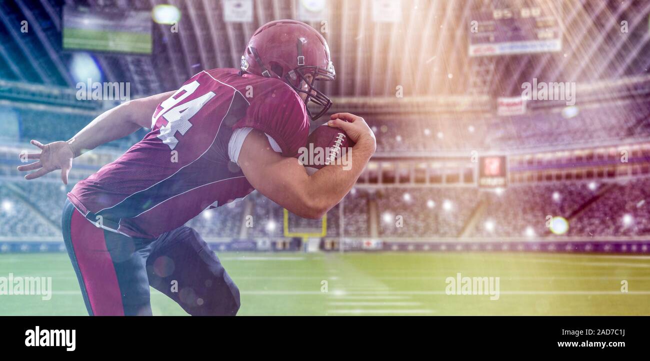 American football Player running with the ball Stock Photo - Alamy