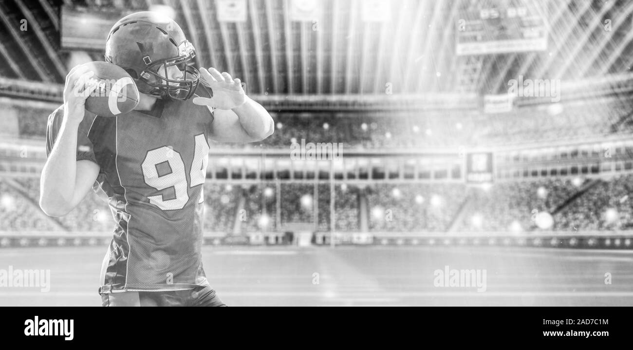 American football Player running with the ball Stock Photo - Alamy