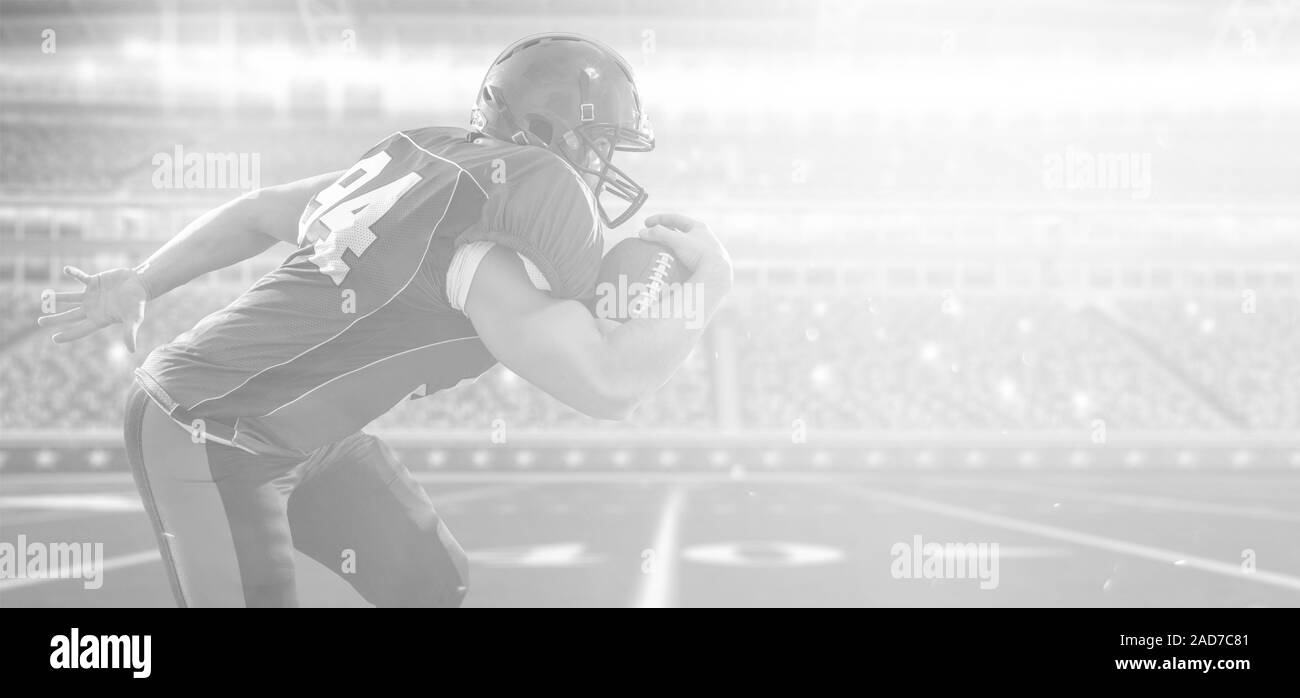 American football Player running with the ball Stock Photo - Alamy