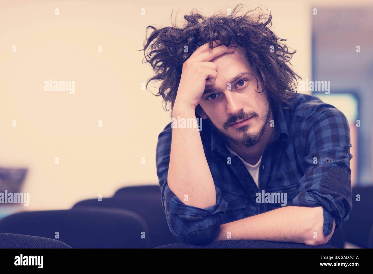 A student sits alone in a classroom Stock Photo - Alamy