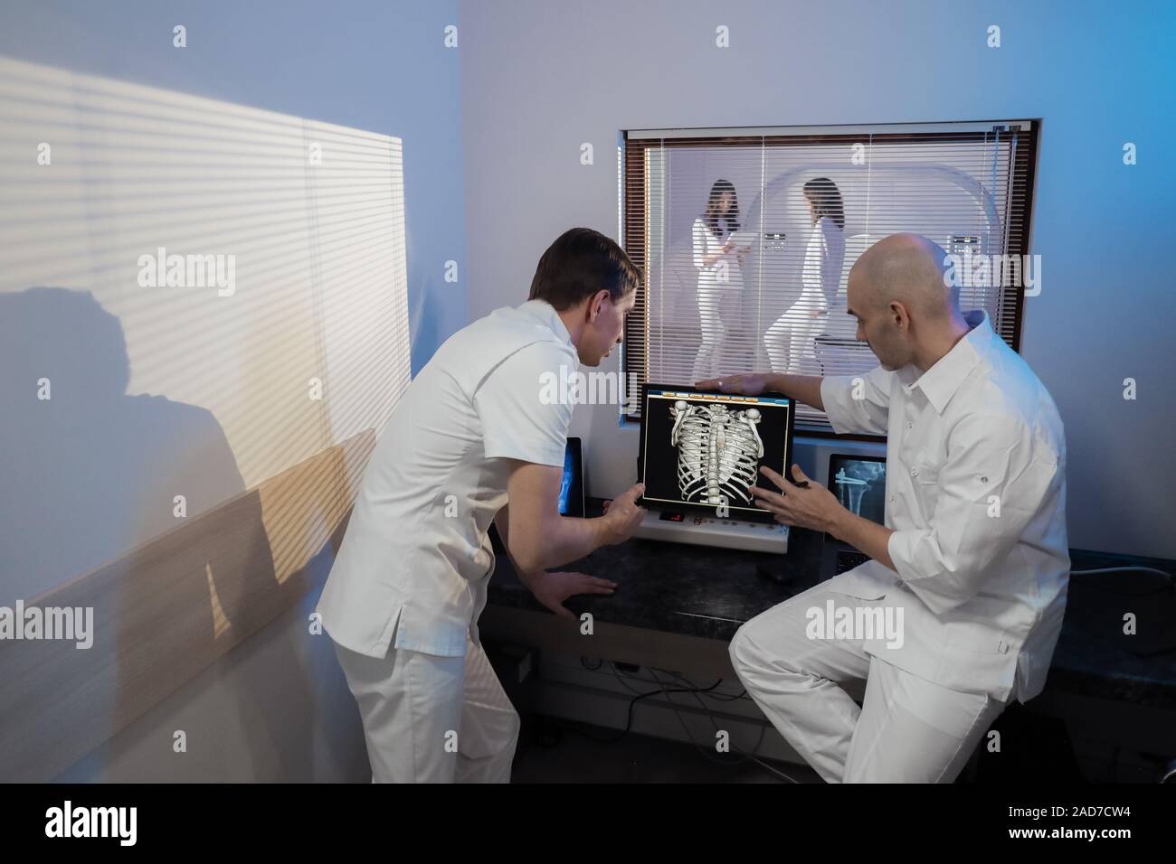 In Control Room Doctor and Radiologist Discuss Diagnosis while Watching ...