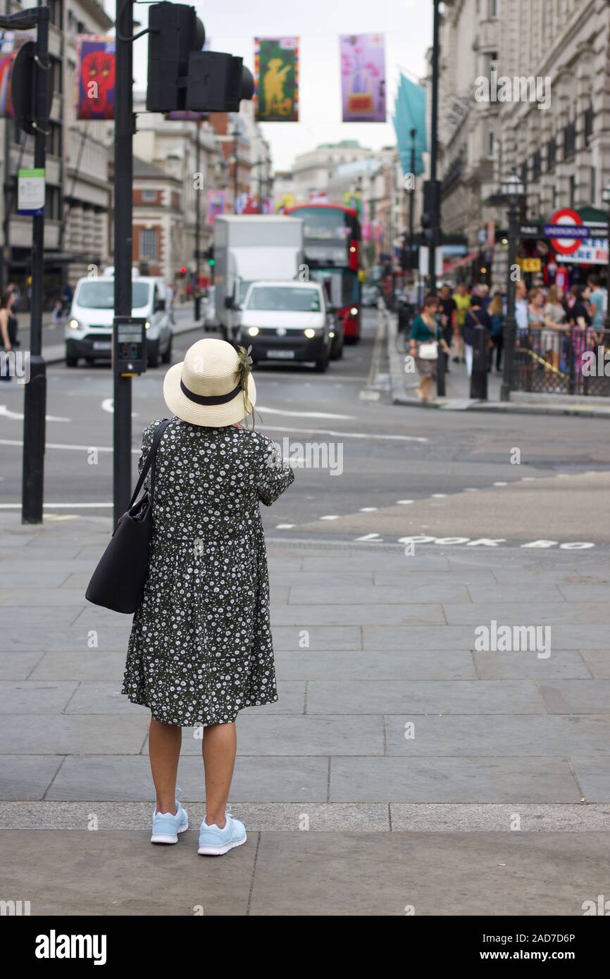 Old lady crossing street hi-res stock photography and images - Alamy