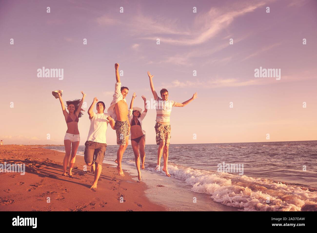 people group running on the beach Stock Photo - Alamy
