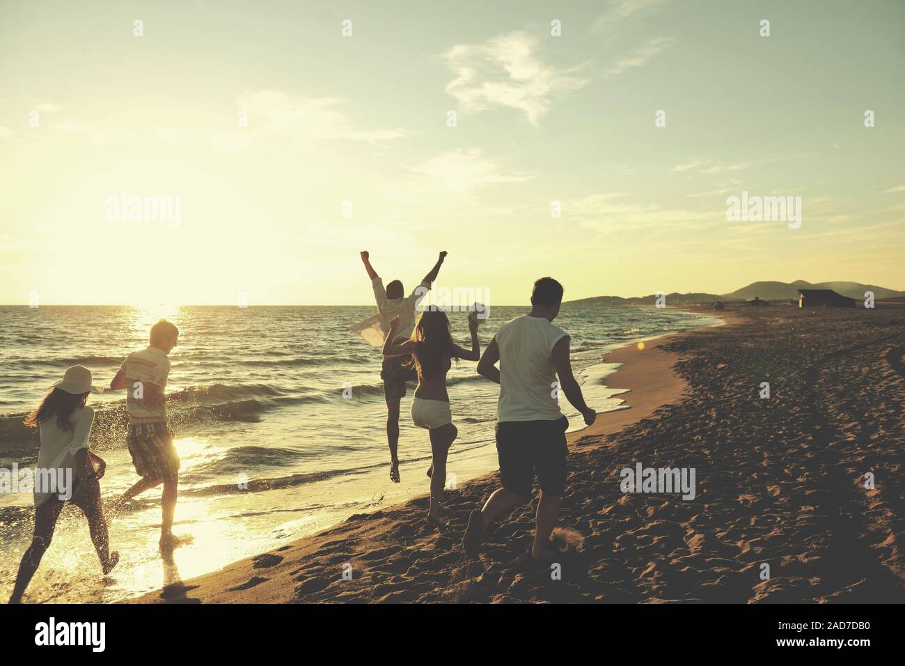 people group running on the beach Stock Photo - Alamy