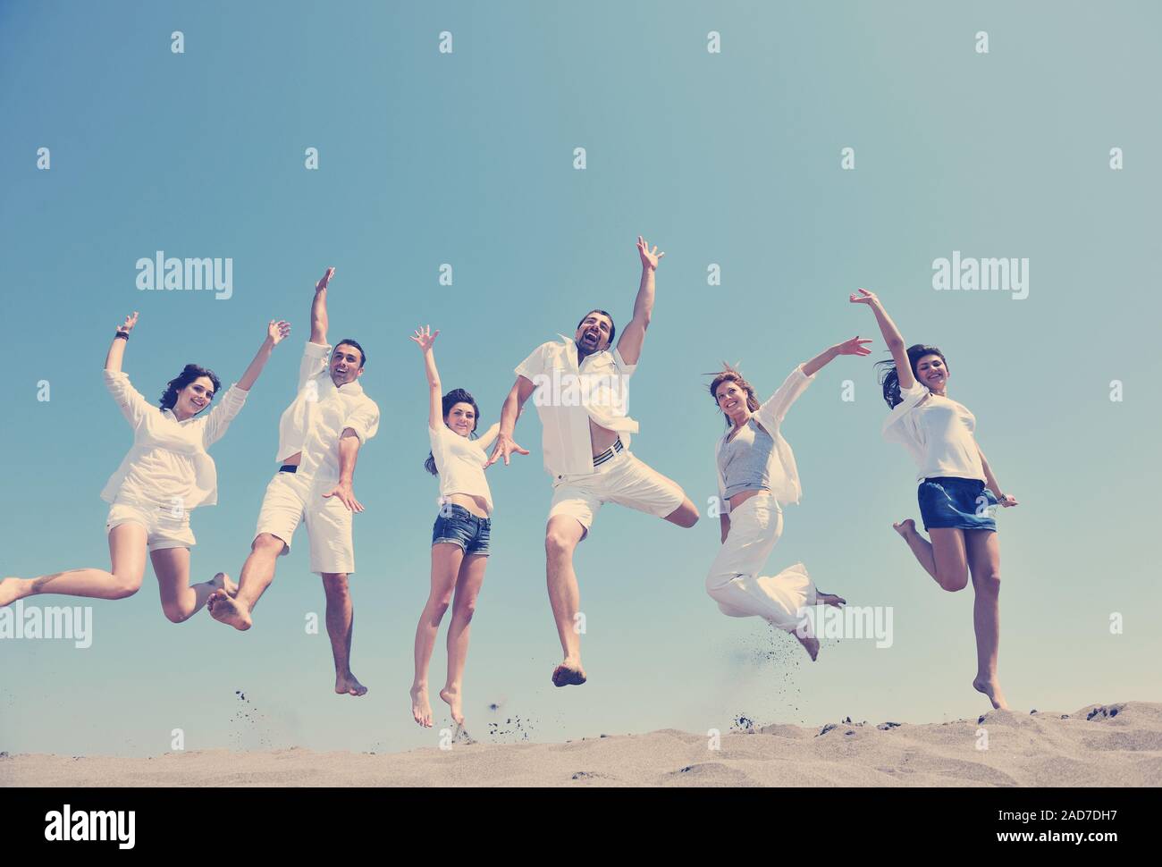 happy people group have fun and running on beach Stock Photo - Alamy