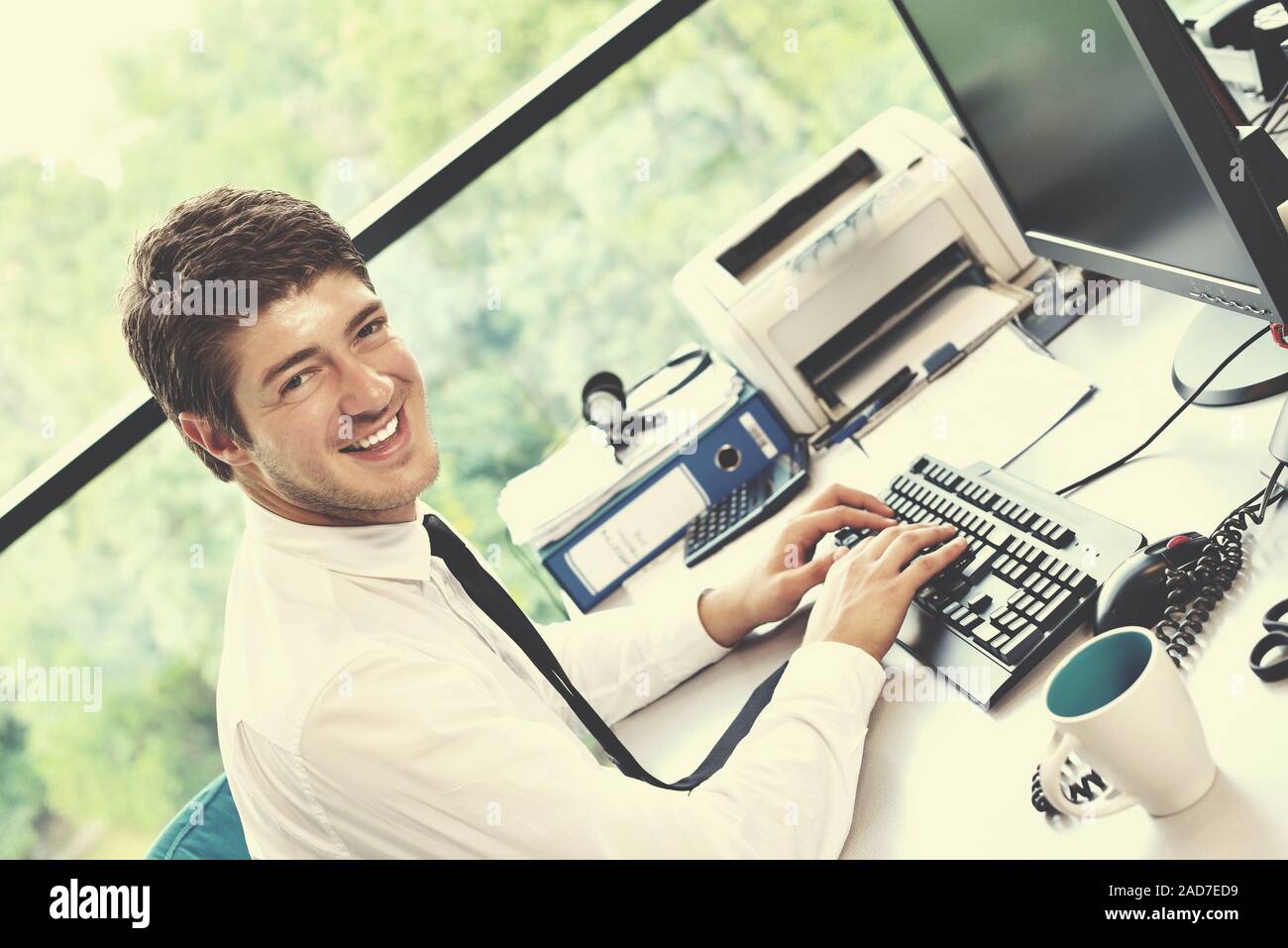 Happy young corporate man hi-res stock photography and images - Alamy
