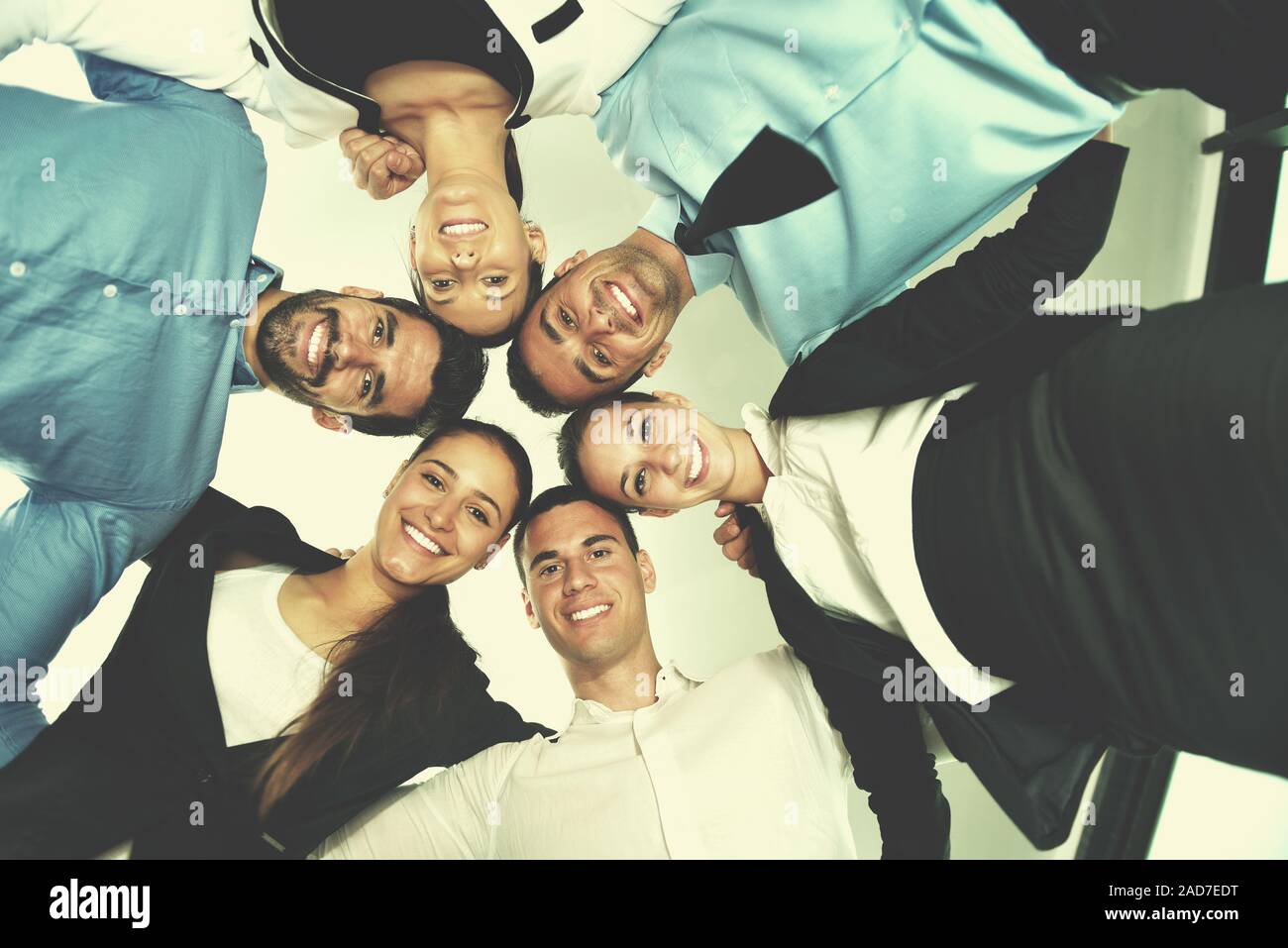 Business people with their heads together Stock Photo - Alamy