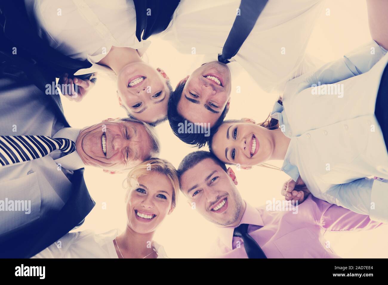 Business people with their heads together Stock Photo - Alamy