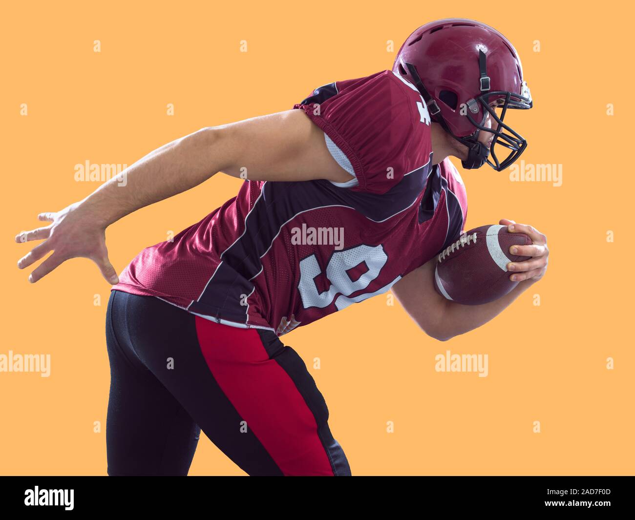 American football Player running with the ball Stock Photo - Alamy