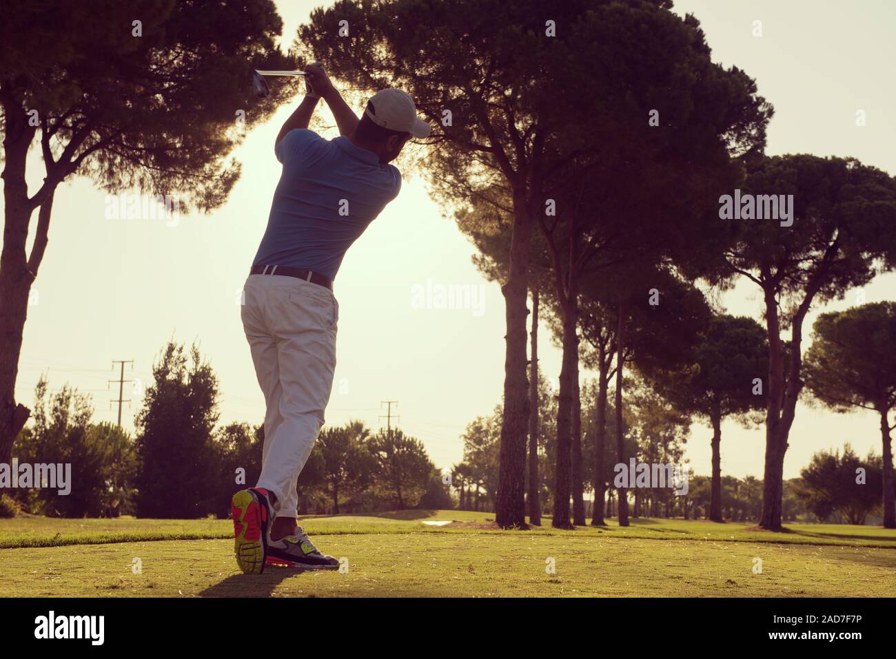 golf player hitting shot Stock Photo - Alamy