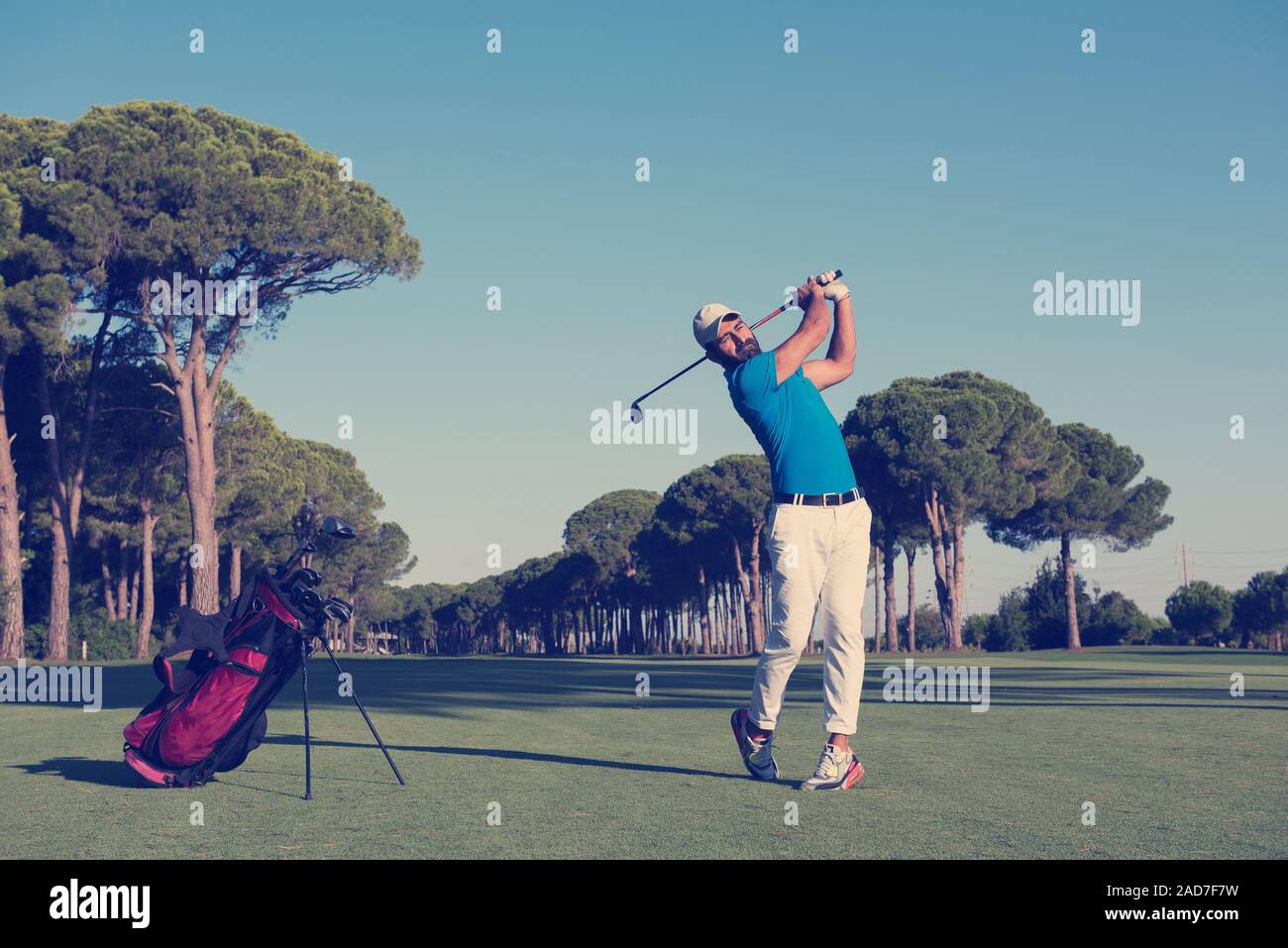 golf player hitting long shot Stock Photo - Alamy