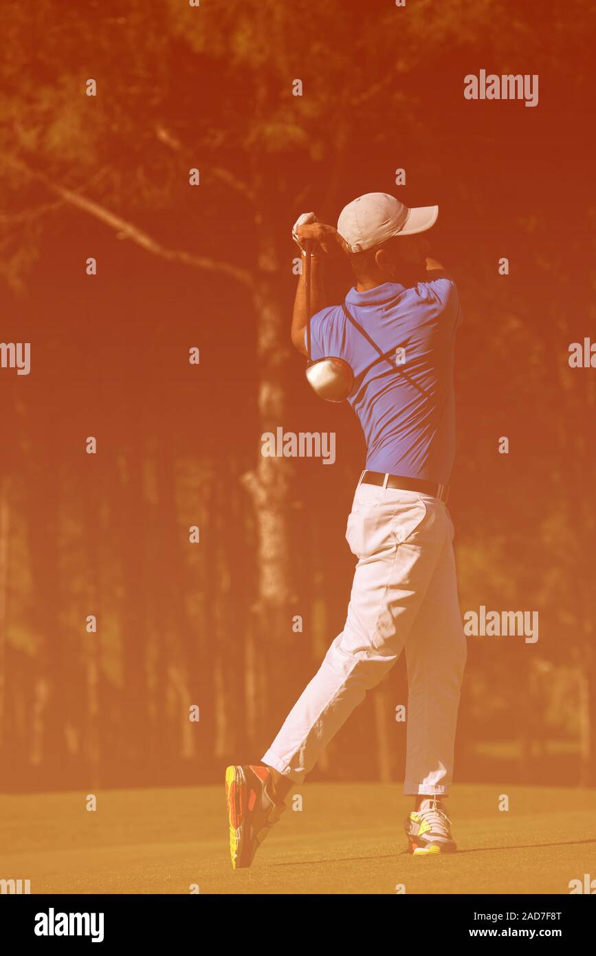 golf player hitting long shot Stock Photo - Alamy