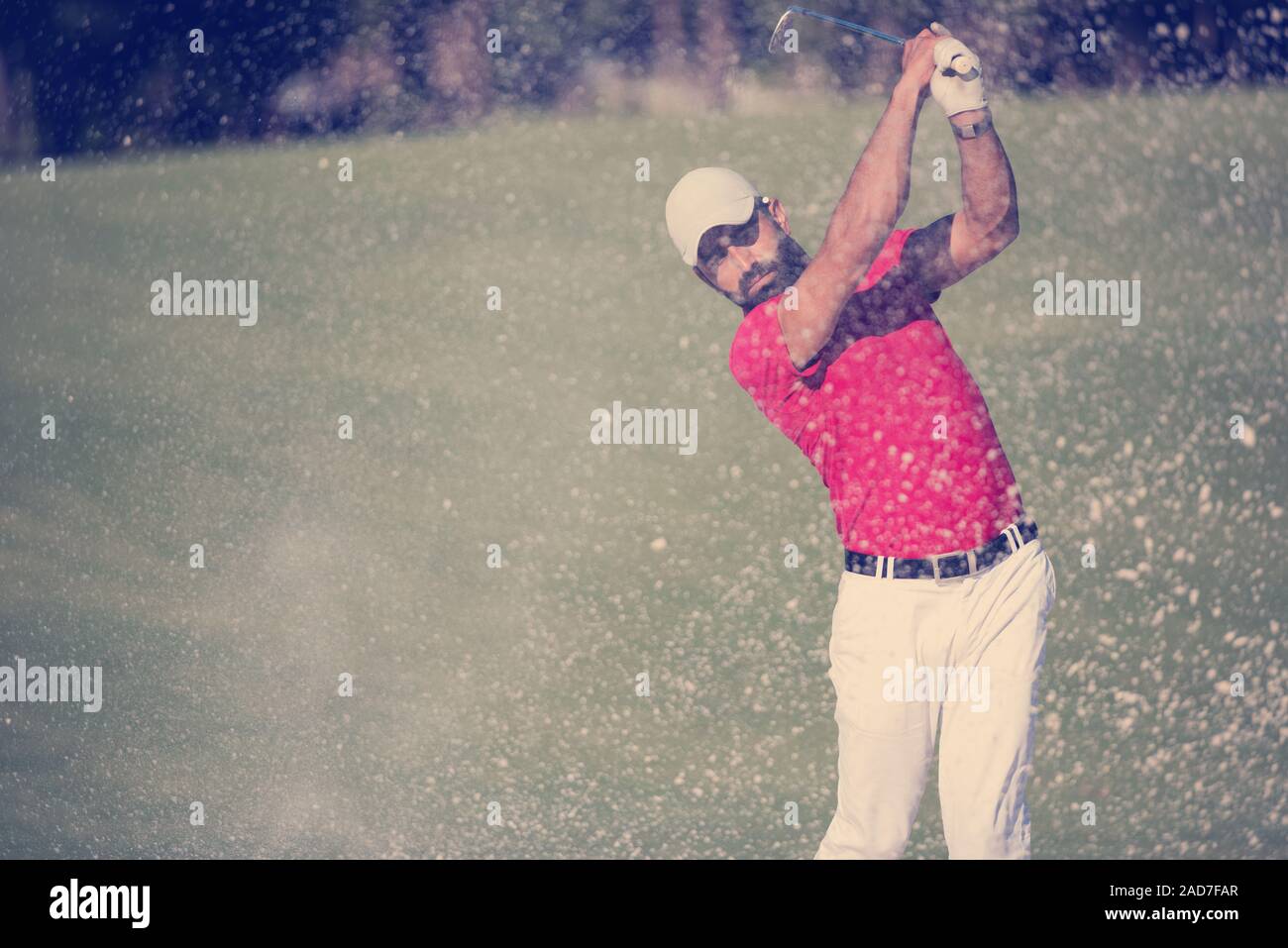 golfer hitting a sand bunker shot Stock Photo - Alamy