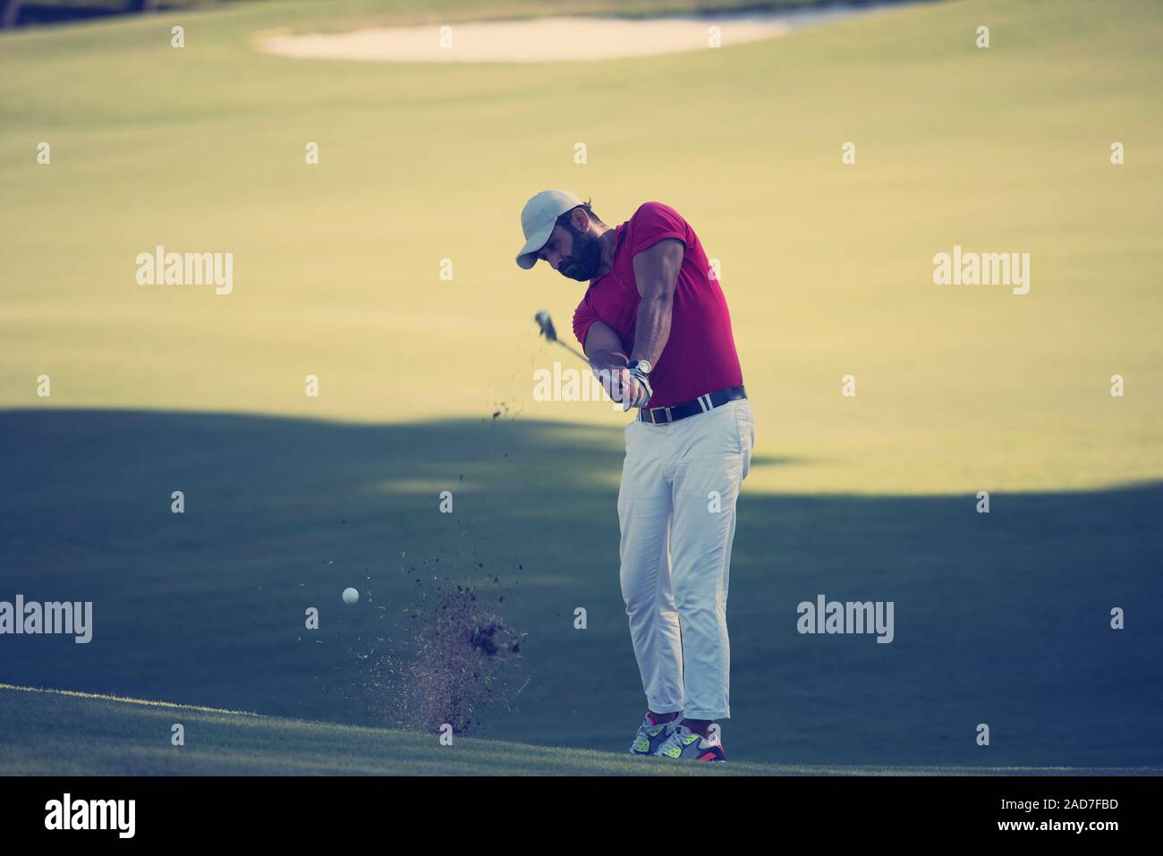 golf player hitting long shot Stock Photo - Alamy