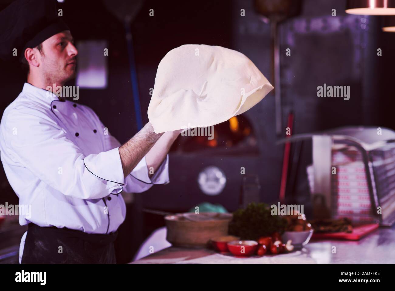 chef throwing up pizza dough Stock Photo - Alamy
