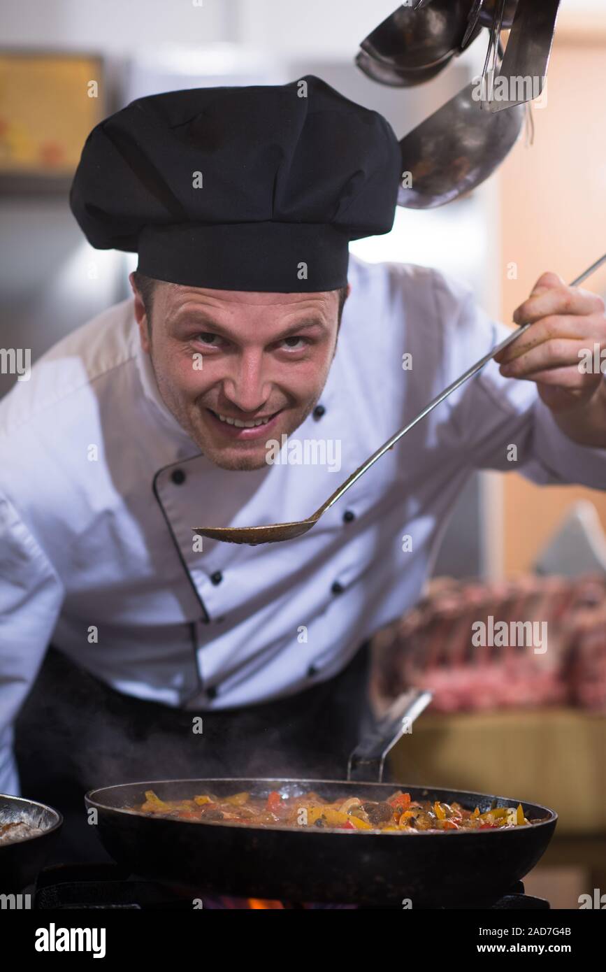 Testing food with spoon hi-res stock photography and images - Alamy