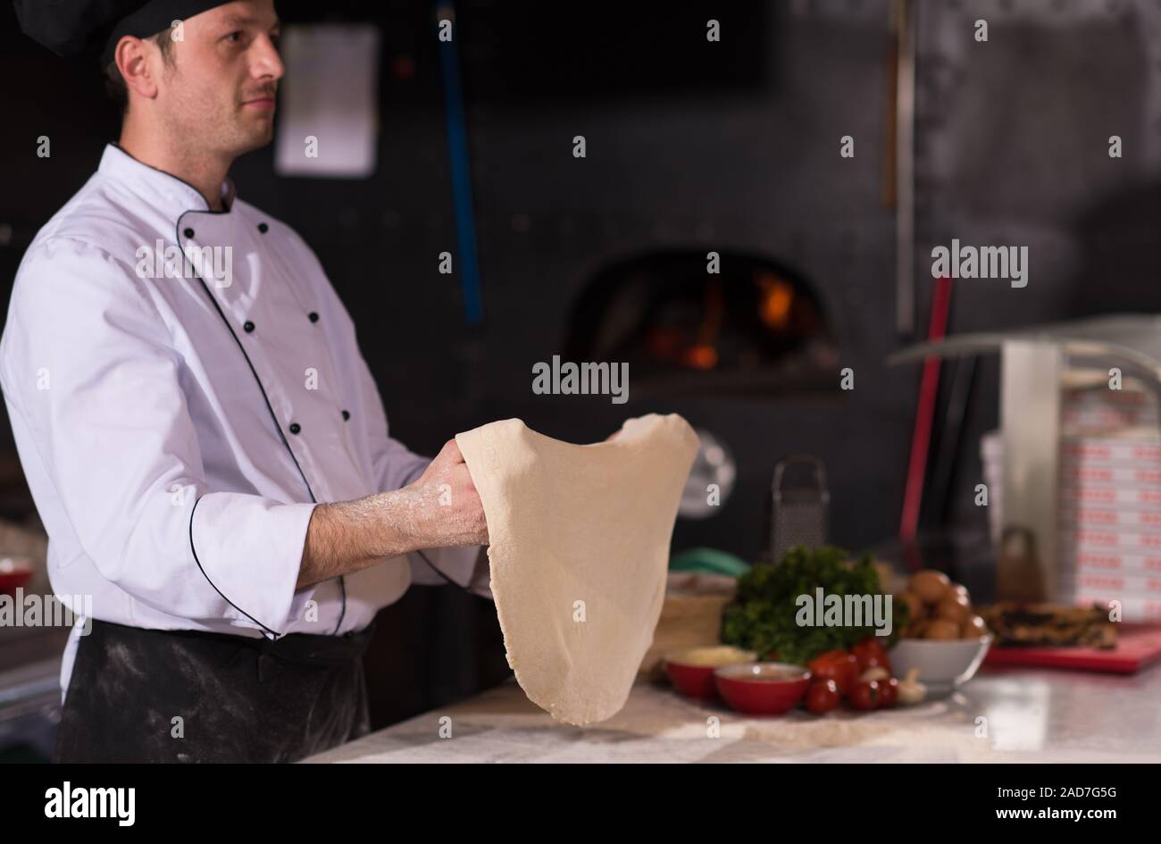 chef throwing up pizza dough Stock Photo - Alamy