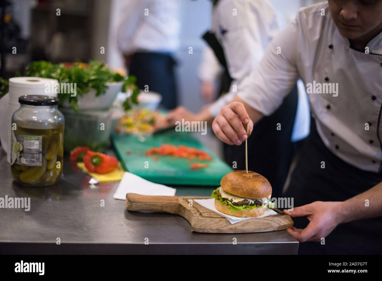 chef finishing burger Stock Photo - Alamy