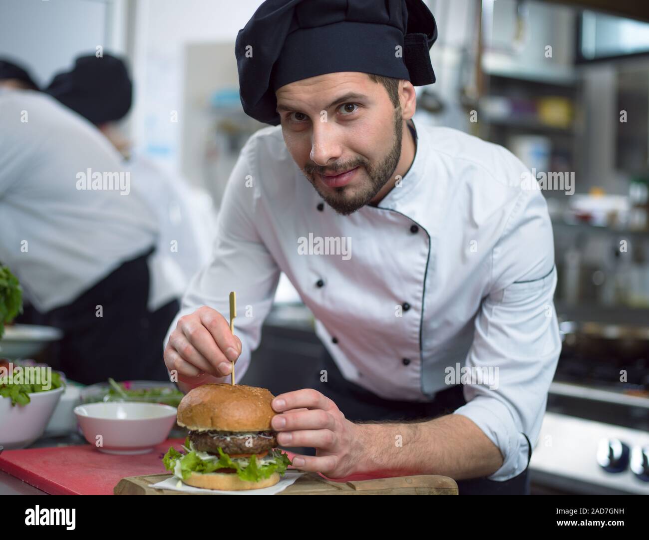 chef finishing burger Stock Photo - Alamy