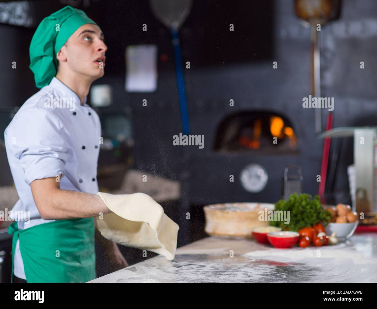 Throwing pizza dough up hi-res stock photography and images - Alamy