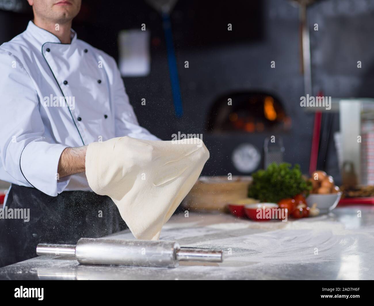 chef throwing up pizza dough Stock Photo - Alamy