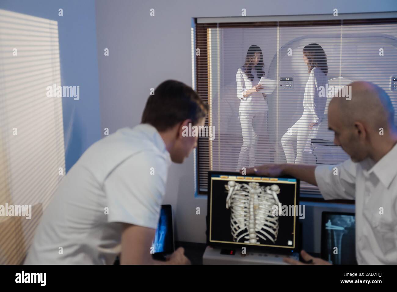 In Control Room Doctor and Radiologist Discuss Diagnosis while Watching ...