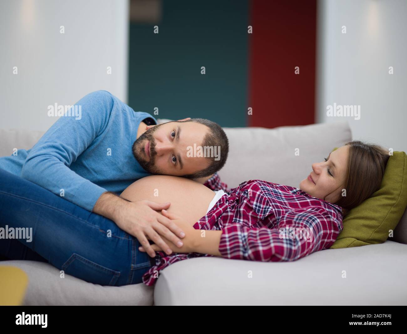 future dad listening the belly of his pregnant wife Stock Photo - Alamy