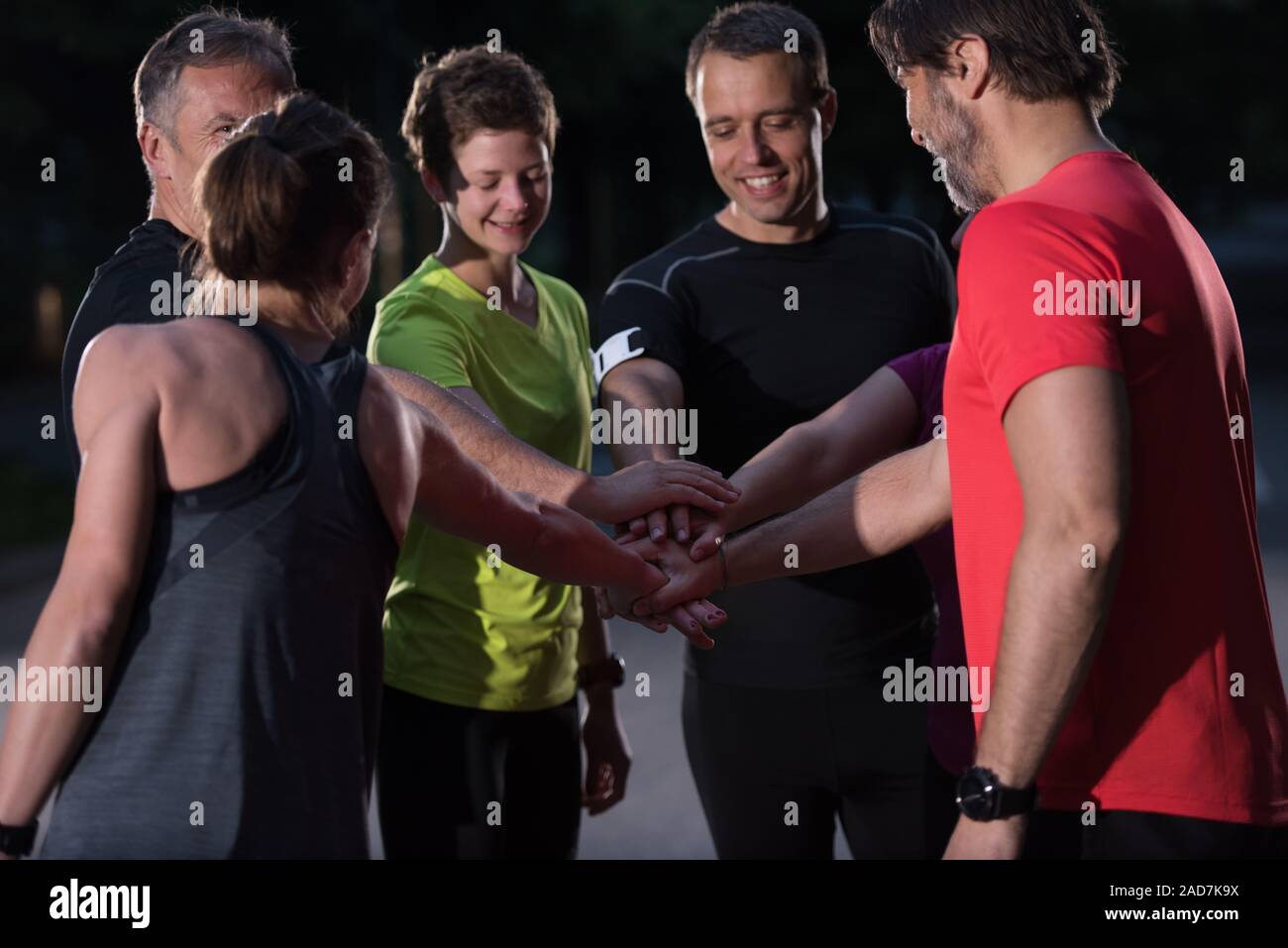 runners giving high five to each other Stock Photo - Alamy