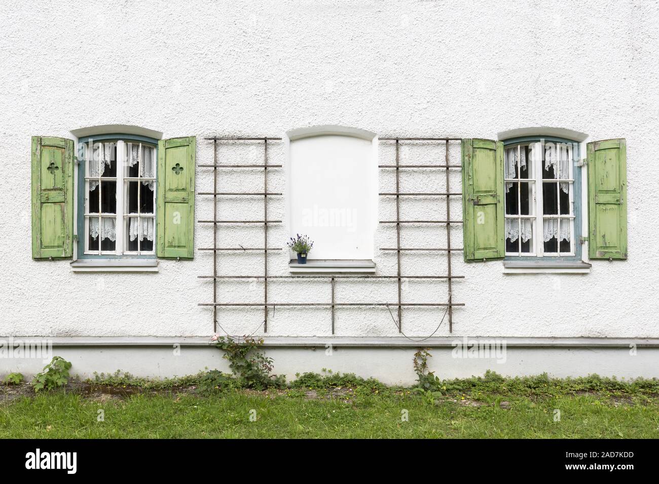 Two windows with windows on an old house Stock Photo - Alamy