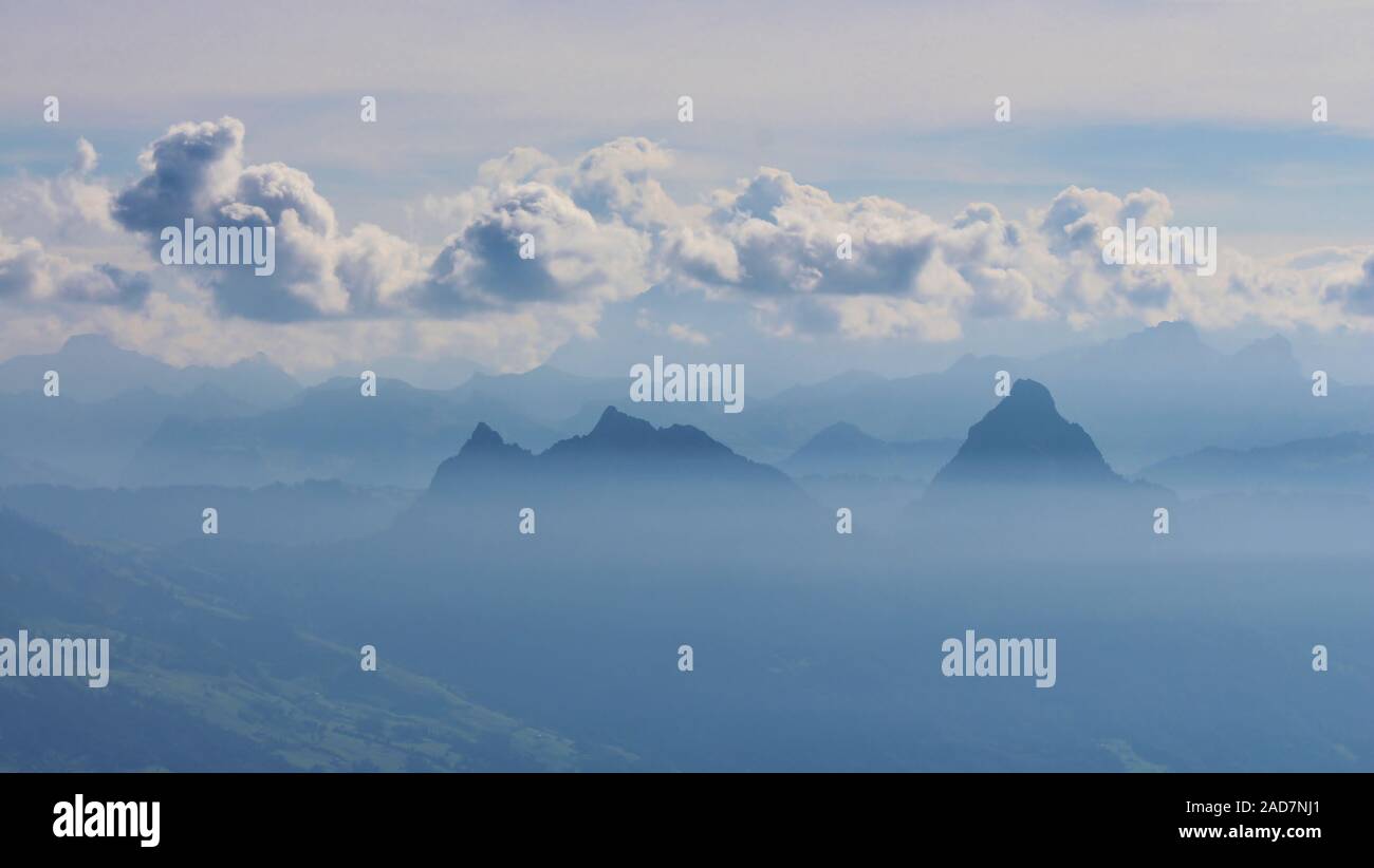 Peaks of Mount Kleiner Mythen and Mount Grosser Mythen reaching out of ...