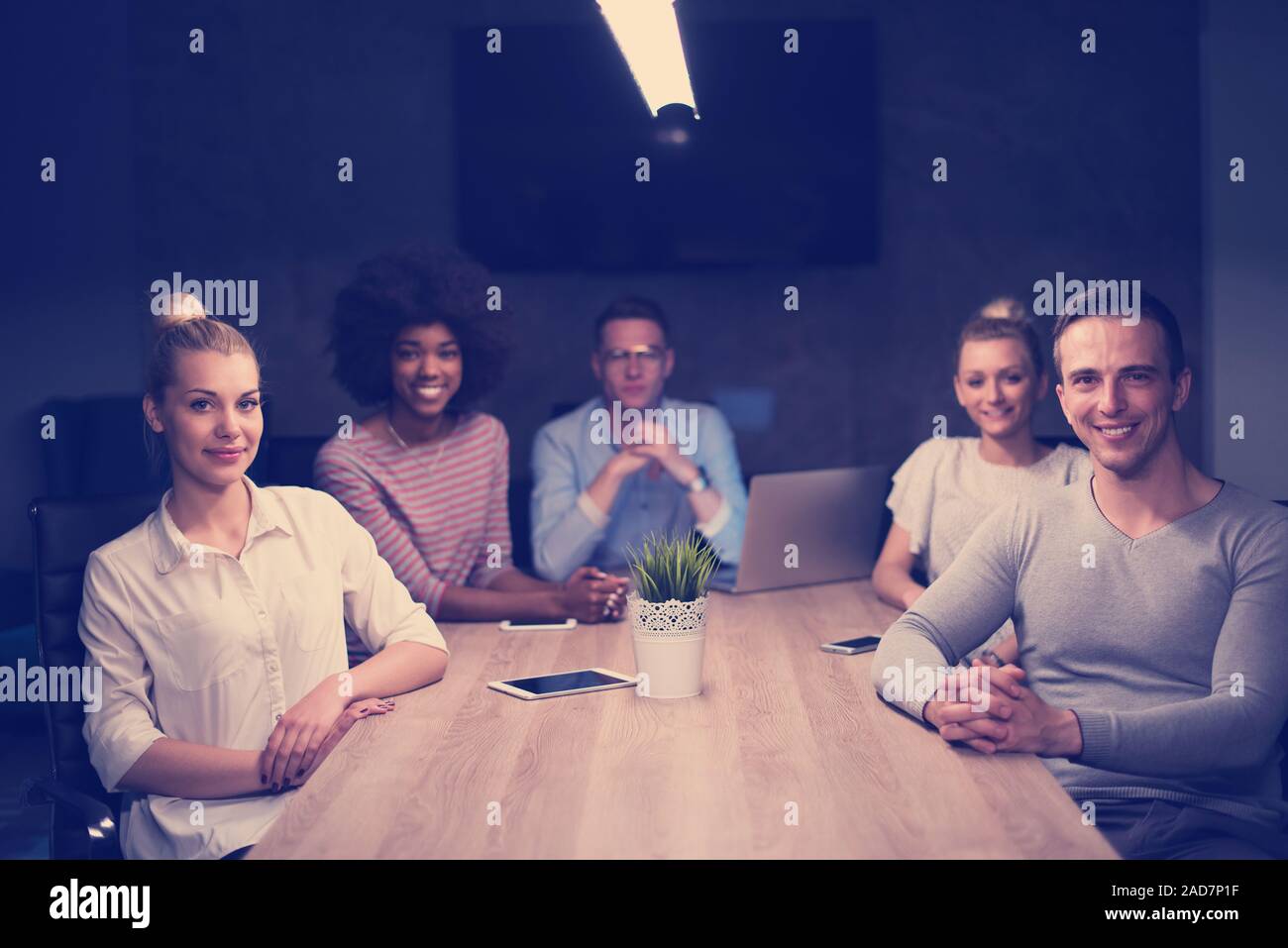 Multiethnic startup Business team in night office Stock Photo - Alamy
