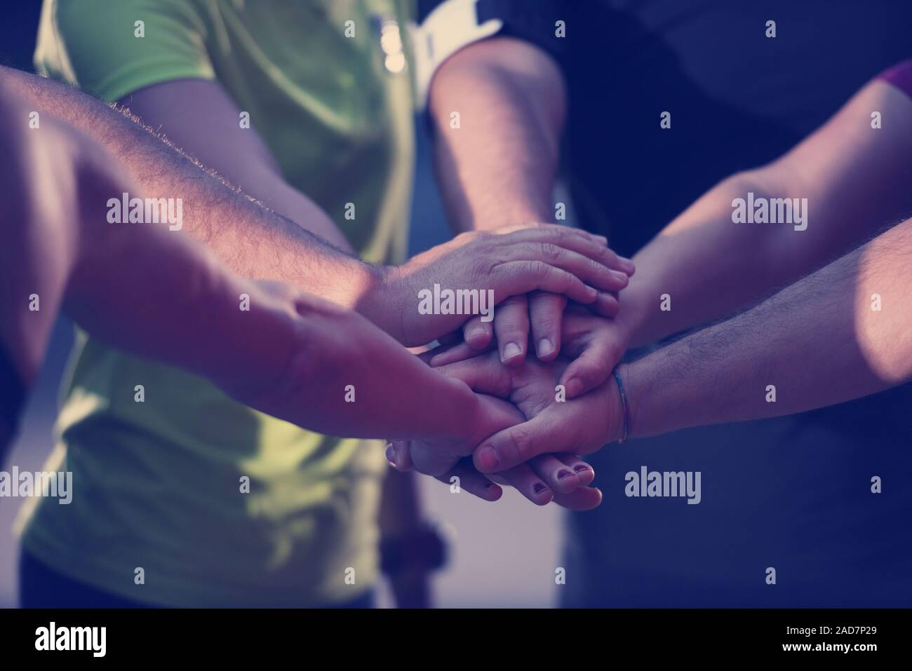 runners giving high five to each other Stock Photo - Alamy