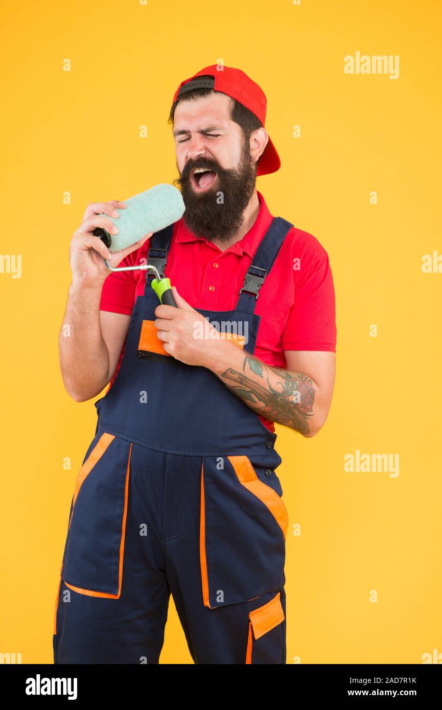 Industrial concept. creative repair concept. bearded man singing in ...