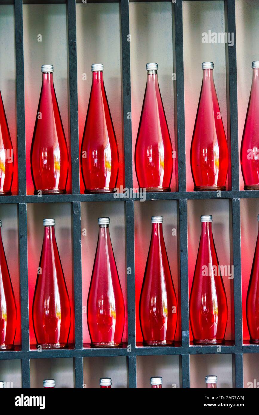 bottles of red juice in modern restaurant Stock Photo - Alamy
