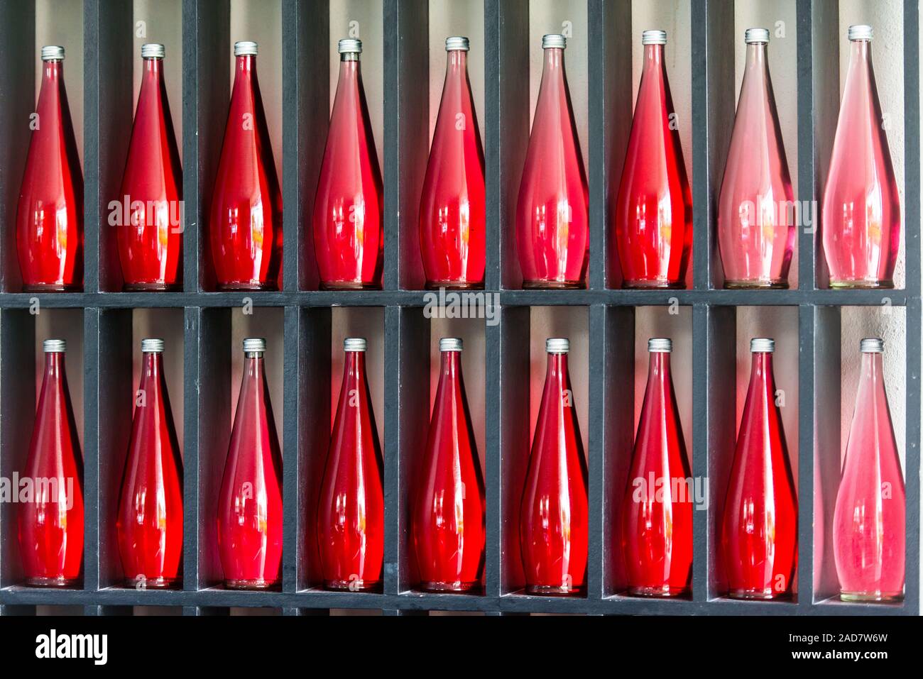 bottles of red juice in modern restaurant Stock Photo - Alamy